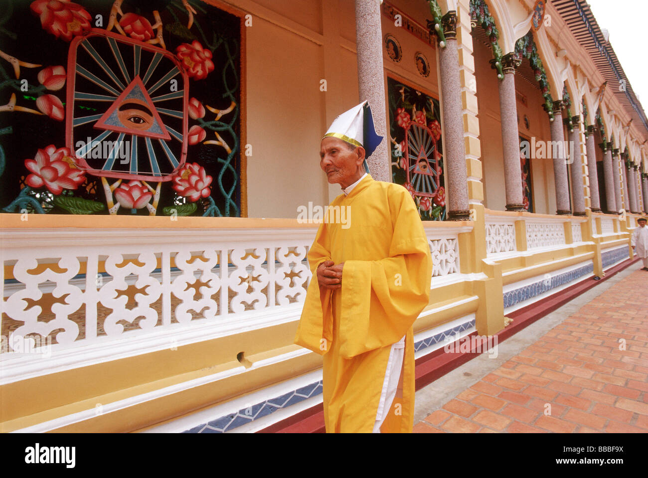 Vietnam, Tay Ninh, Cao Dai lay priest at Cao Dai Great Temple Stock ...
