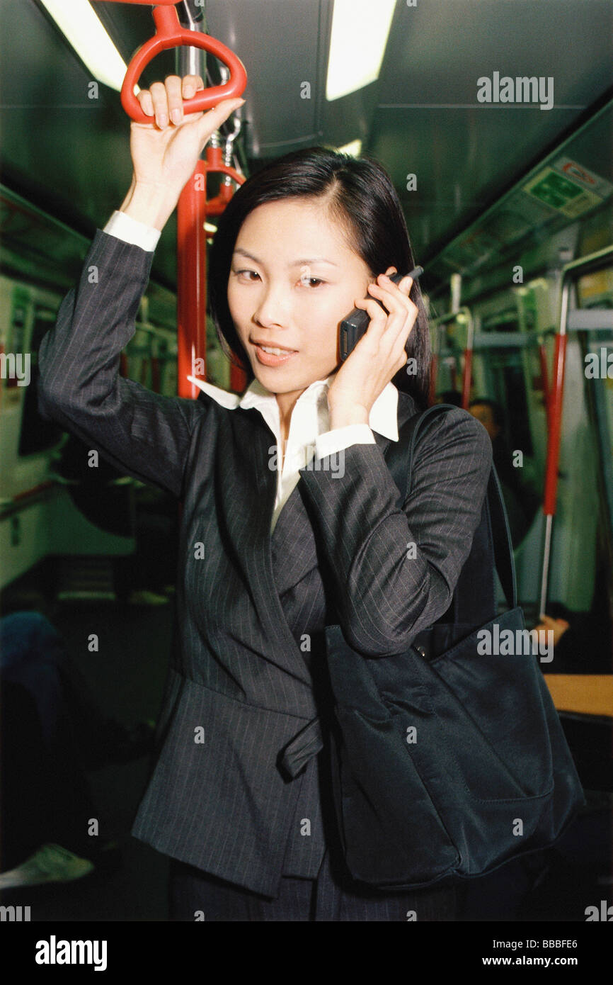 Female executive in subway train hi-res stock photography and images ...