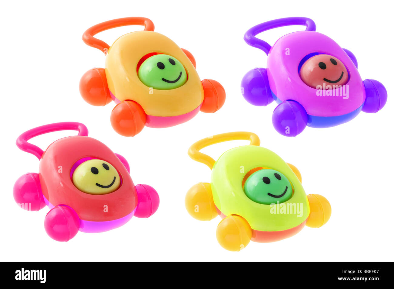 Colorful smiley baby rattle cars arranged on white background Stock ...