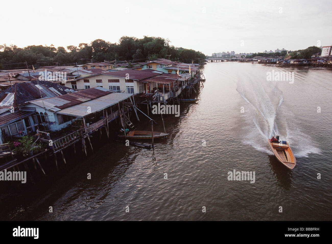 Brunei Darussalam, Borneo, A boat speeds along the river Stock Photo ...