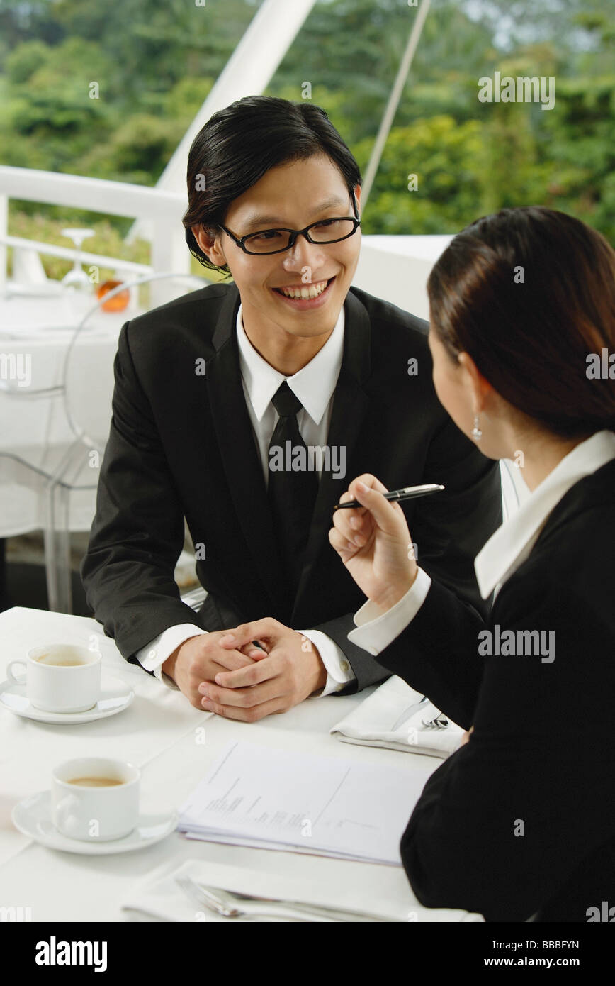 Two executives in restaurant, having a discussion Stock Photo - Alamy
