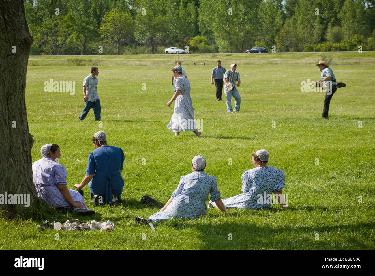 Young Mennonite men and women playing softball Sunday at the park ...