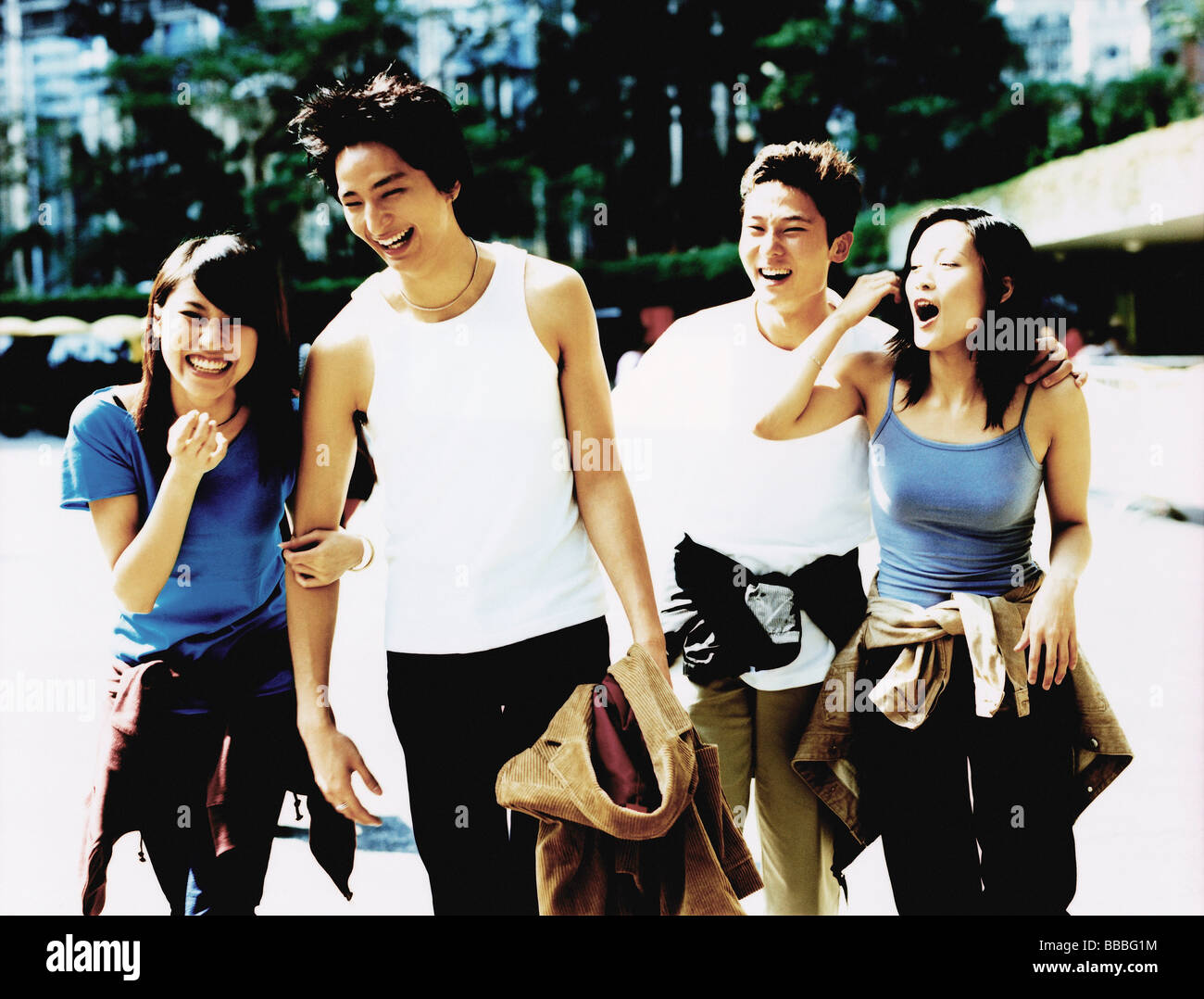 Couples walking and laughing Stock Photo - Alamy