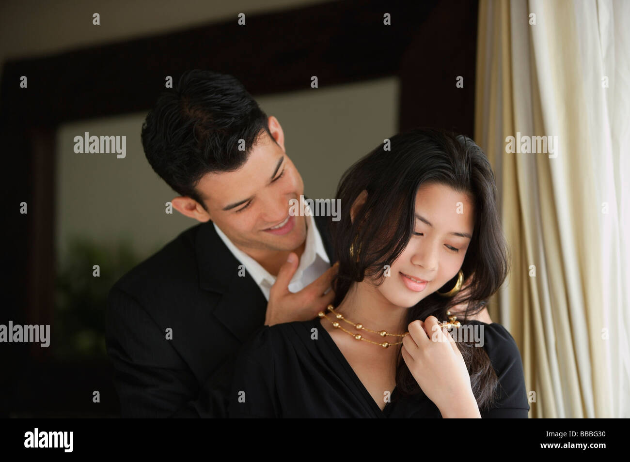 Man caressing woman's neck Stock Photo - Alamy