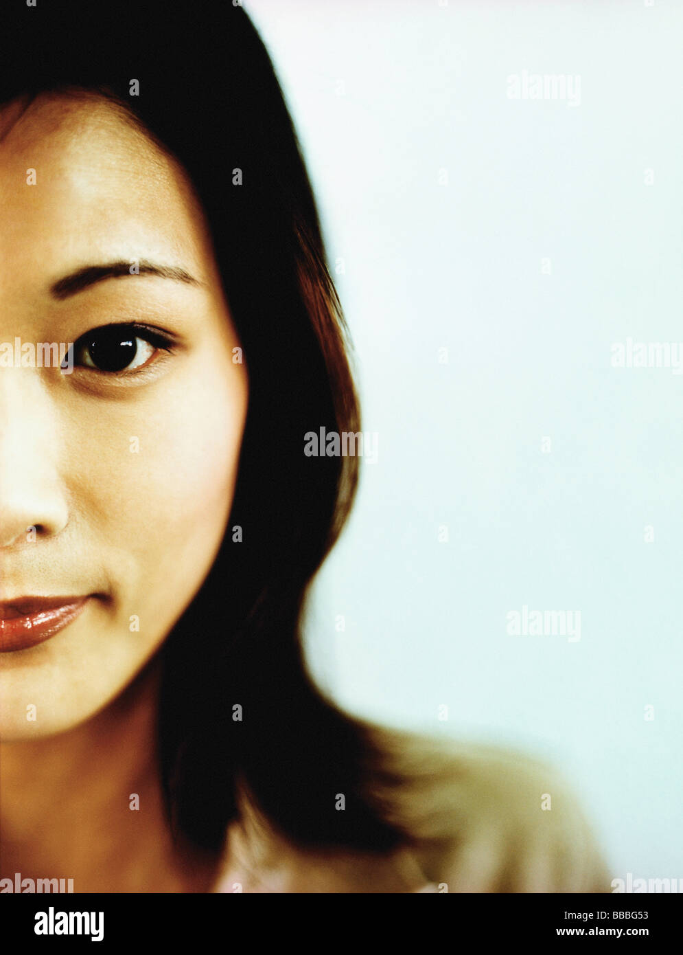 Young woman, half of face shown, portrait Stock Photo - Alamy