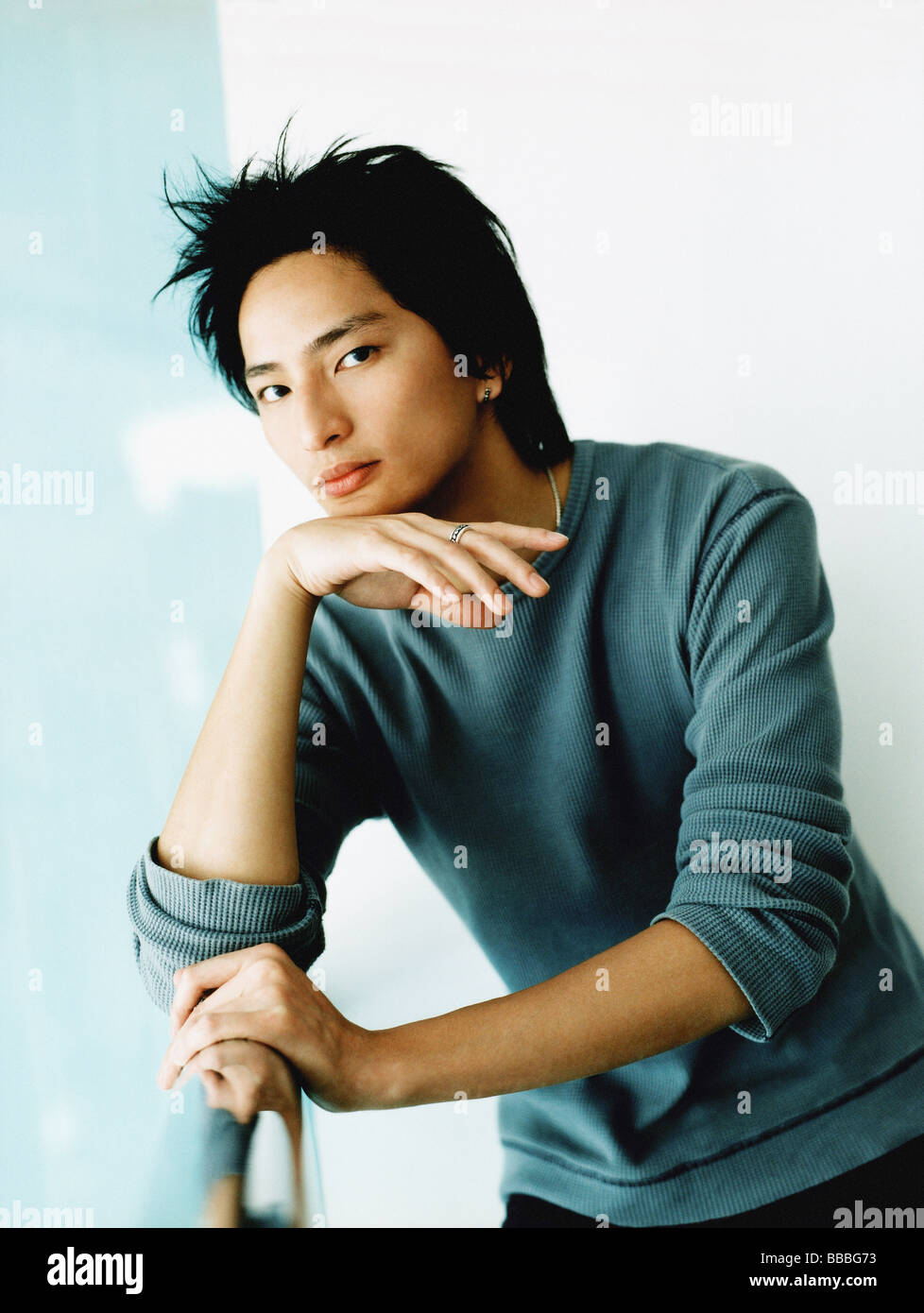 Man leaning on hand rail hi-res stock photography and images - Alamy