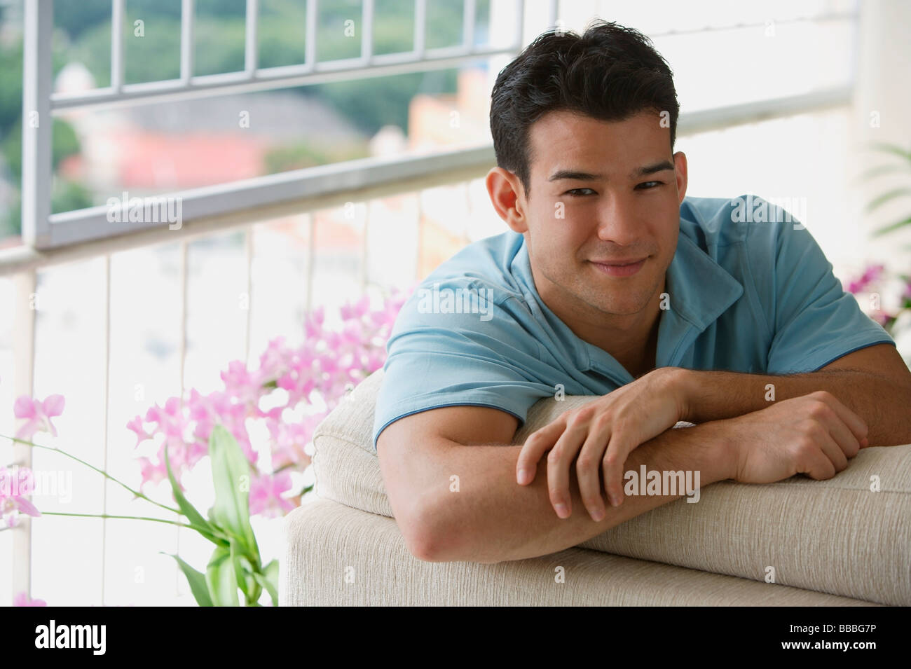 Young man smiling at camera Stock Photo - Alamy