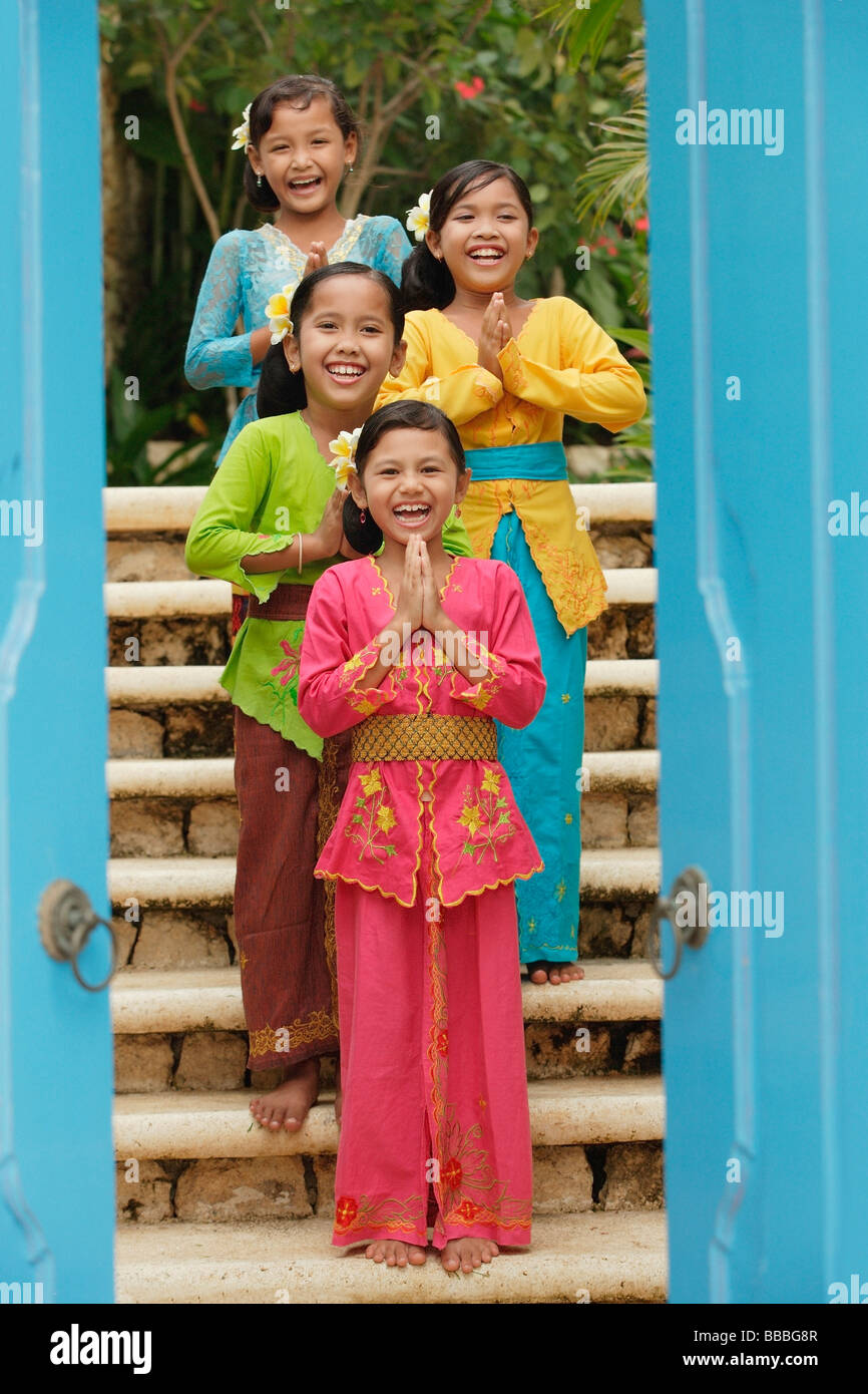 Balinese girls smiling at camera Stock Photo - Alamy