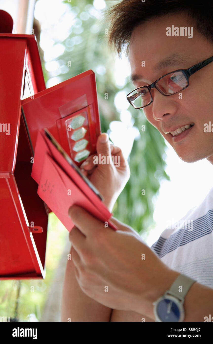 Collecting Mail From Post Box High Resolution Stock Photography and ...