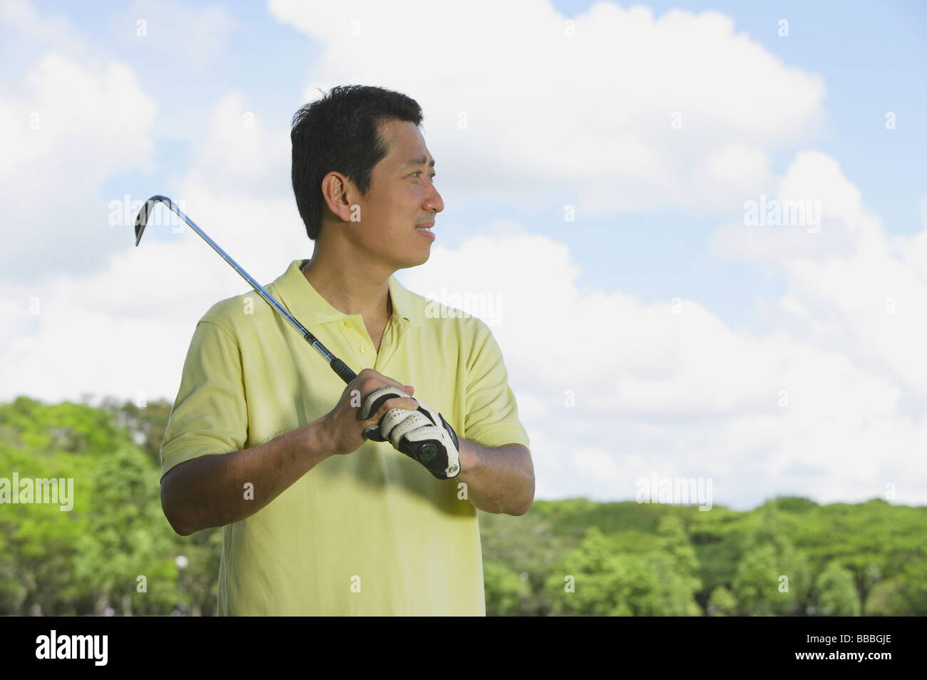 Man with gold club over his shoulder hi-res stock photography and ...