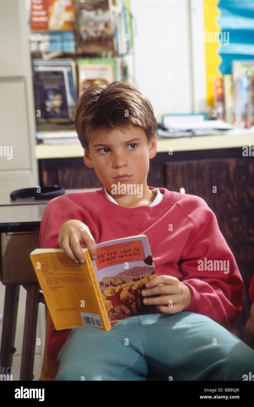 Boy read think thought book serious dream inspire school class Stock ...