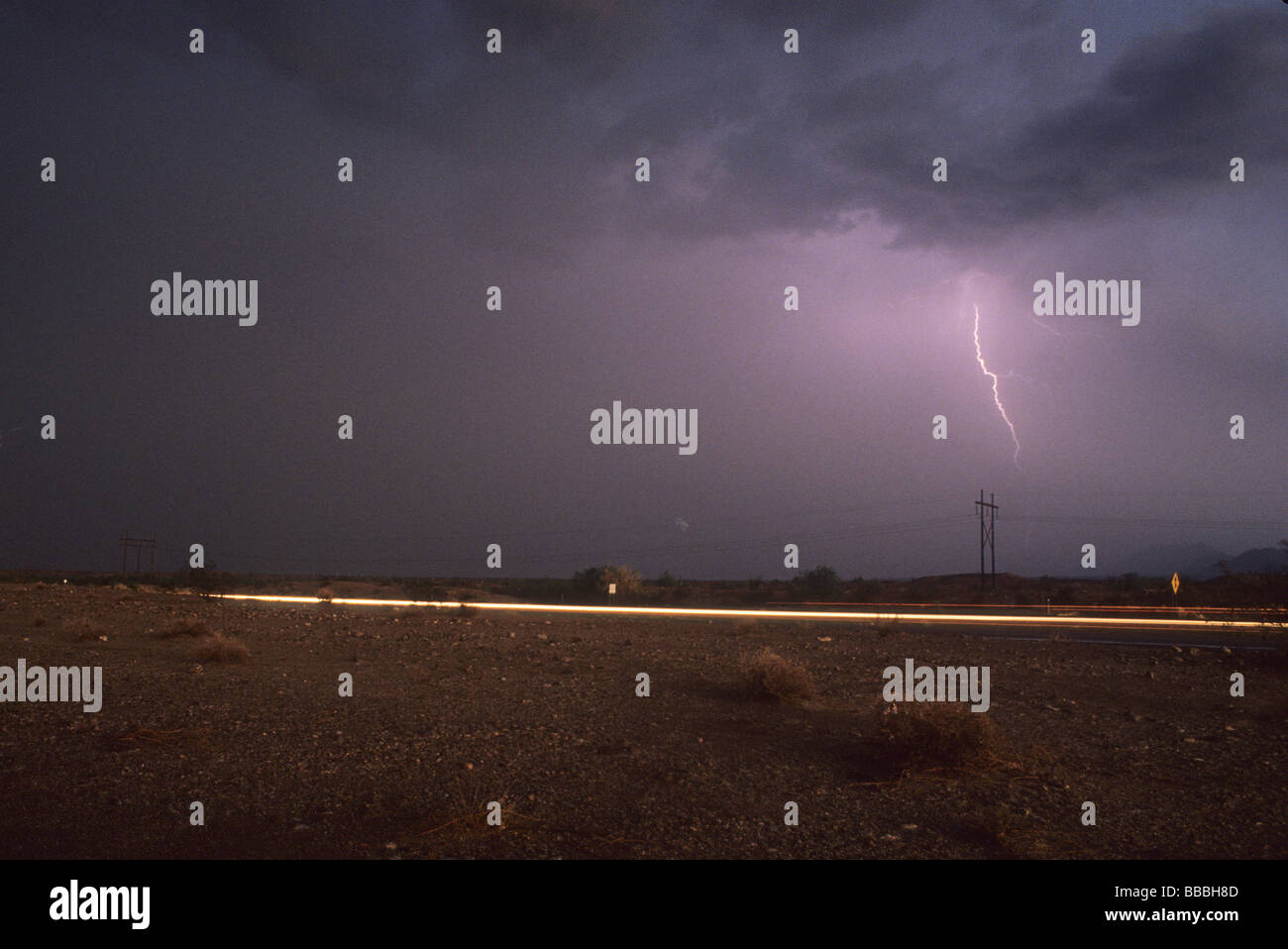 Lightning desert highway car light trace path storm rain blow danger ...
