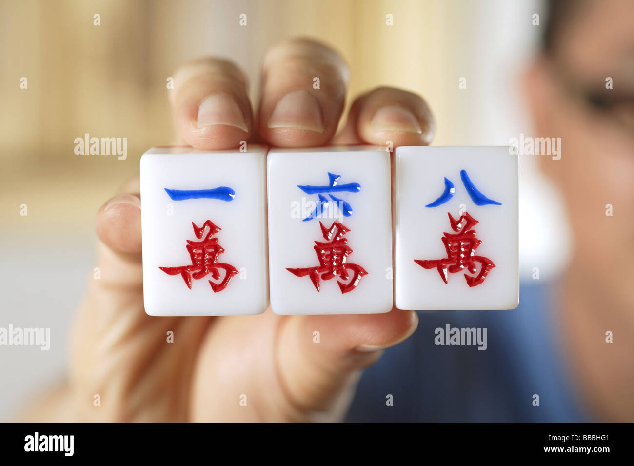 Close-up of mahjong tiles with Chinese characters for One, Six and ...