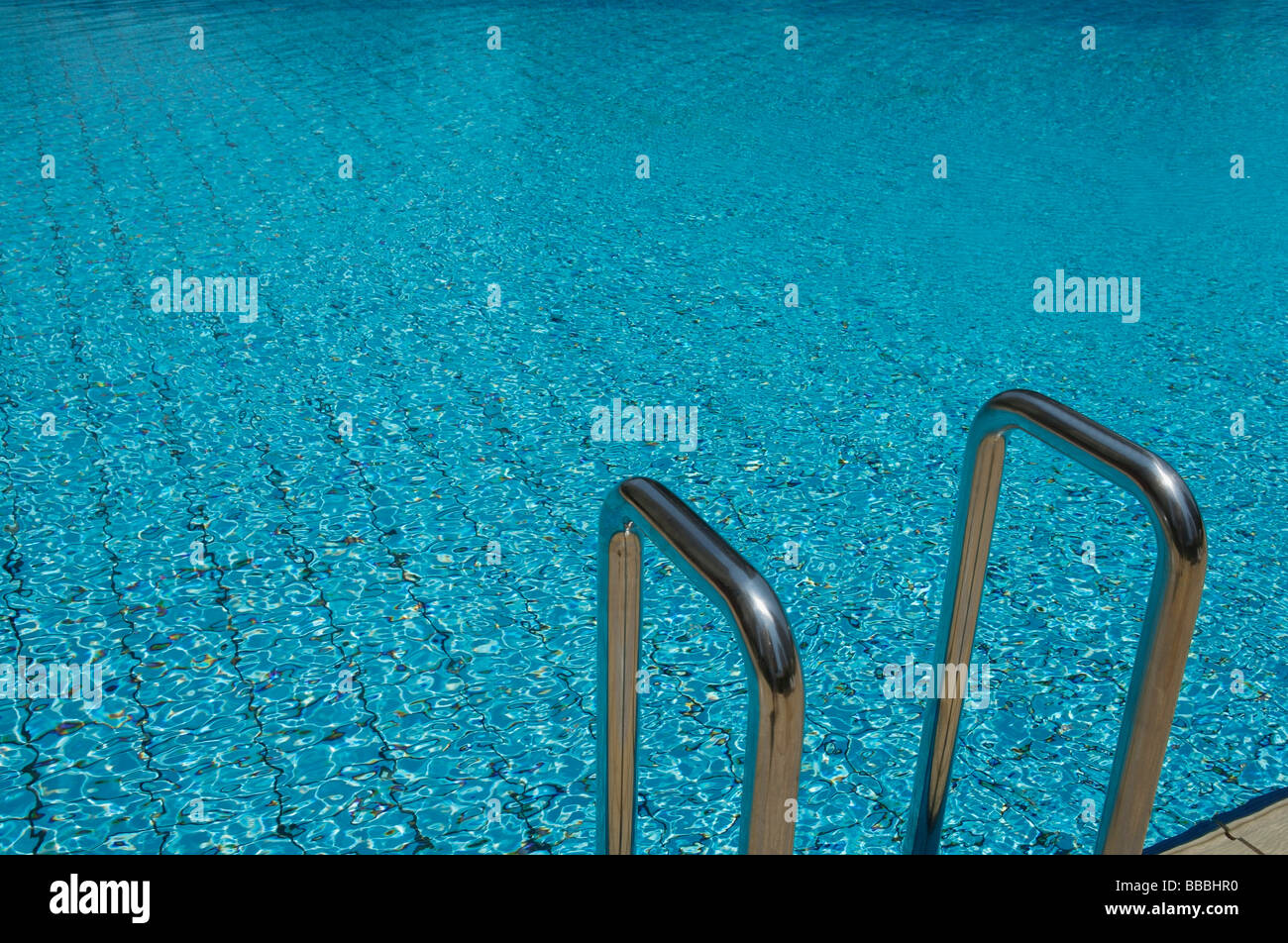 Swimming pool with ladder Stock Photo - Alamy