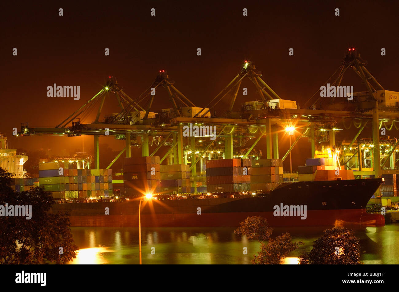 Shipping port at night Stock Photo - Alamy