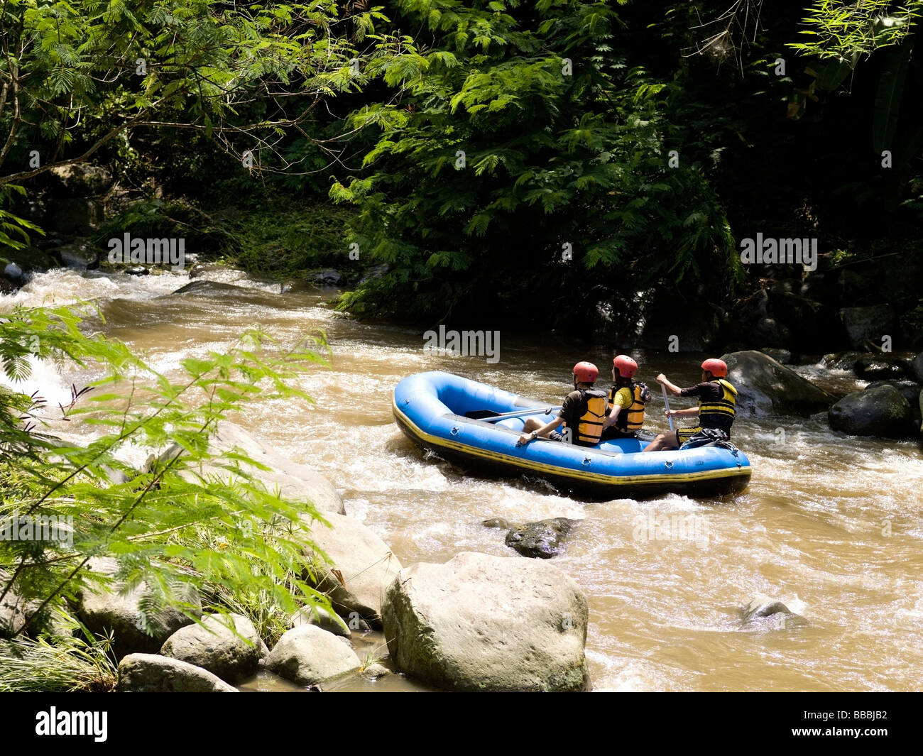 Rafters in inflatable raft on rapid river Stock Photo - Alamy