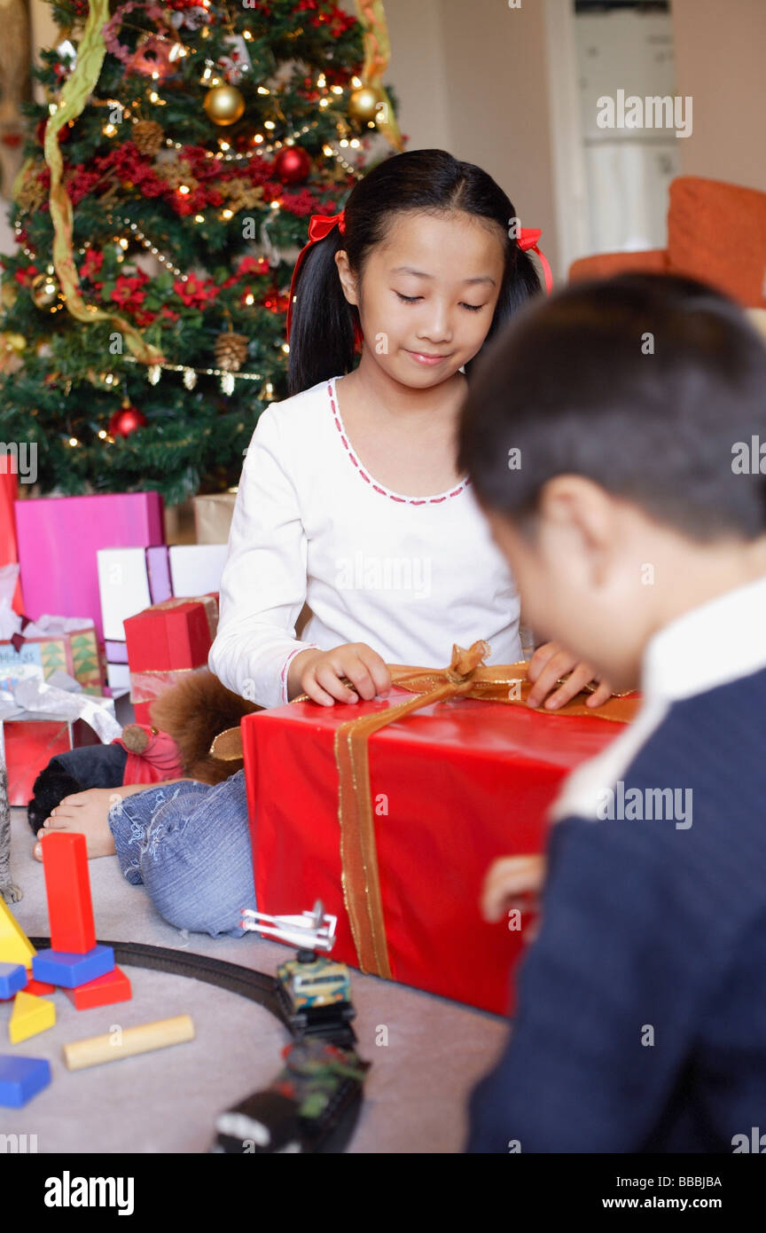 Children opening Christmas presents Stock Photo - Alamy