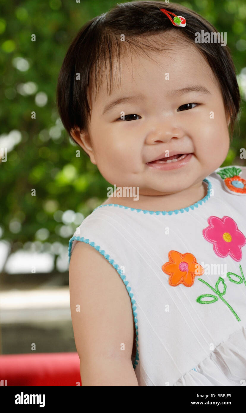 Portrait of baby girl, smiling at camera Stock Photo - Alamy