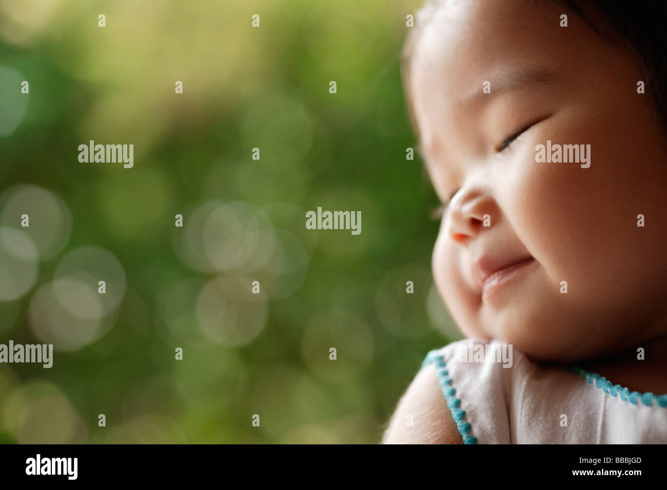 Portrait of baby girl, eyes closed Stock Photo - Alamy