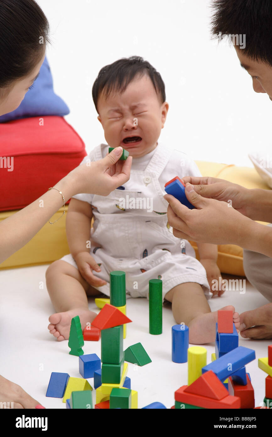 Parents pacify crying child hi-res stock photography and images - Alamy