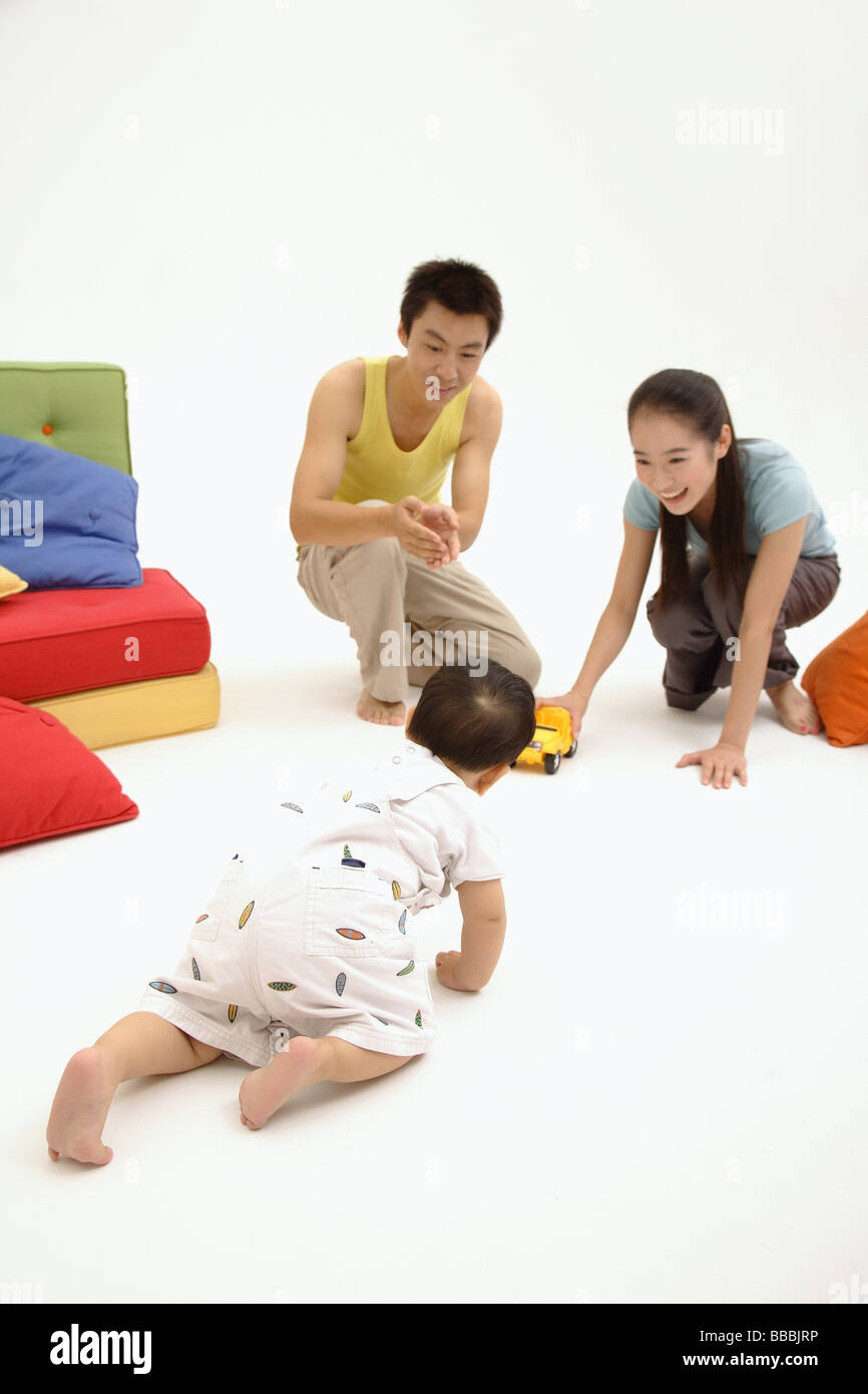 Baby crawling towards mother hi-res stock photography and images - Alamy