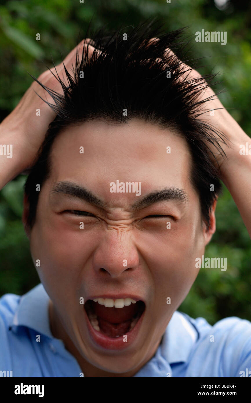 Man hands on head hi-res stock photography and images - Alamy