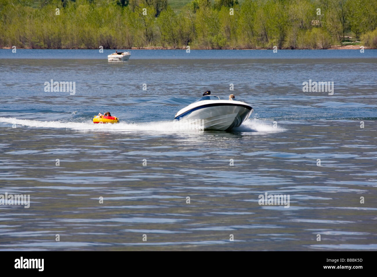 Young girl tubing Stock Photo - Alamy
