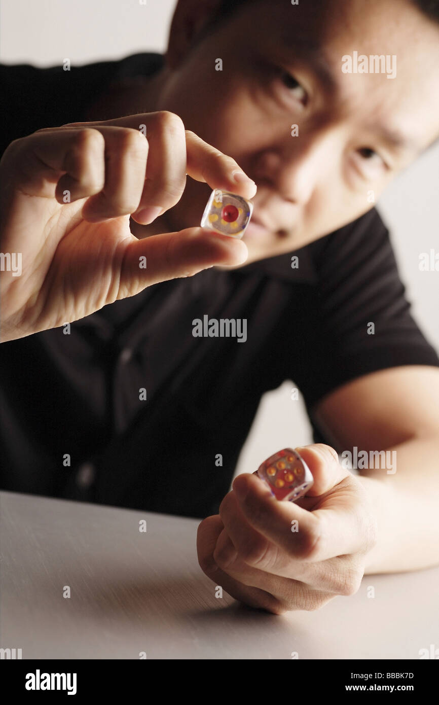 Man holding one dice hi-res stock photography and images - Alamy