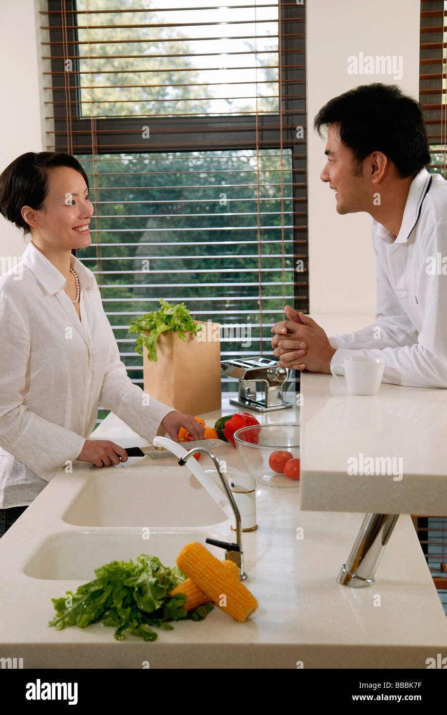 Couple leaning on kitchen counter hi-res stock photography and images ...