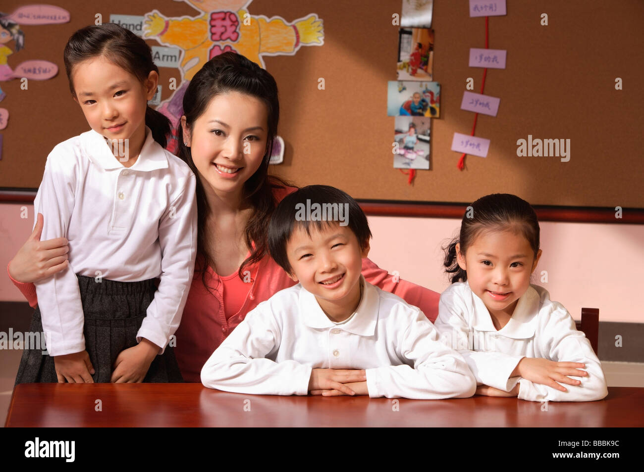 Young school children with their teacher in classroom Stock Photo - Alamy