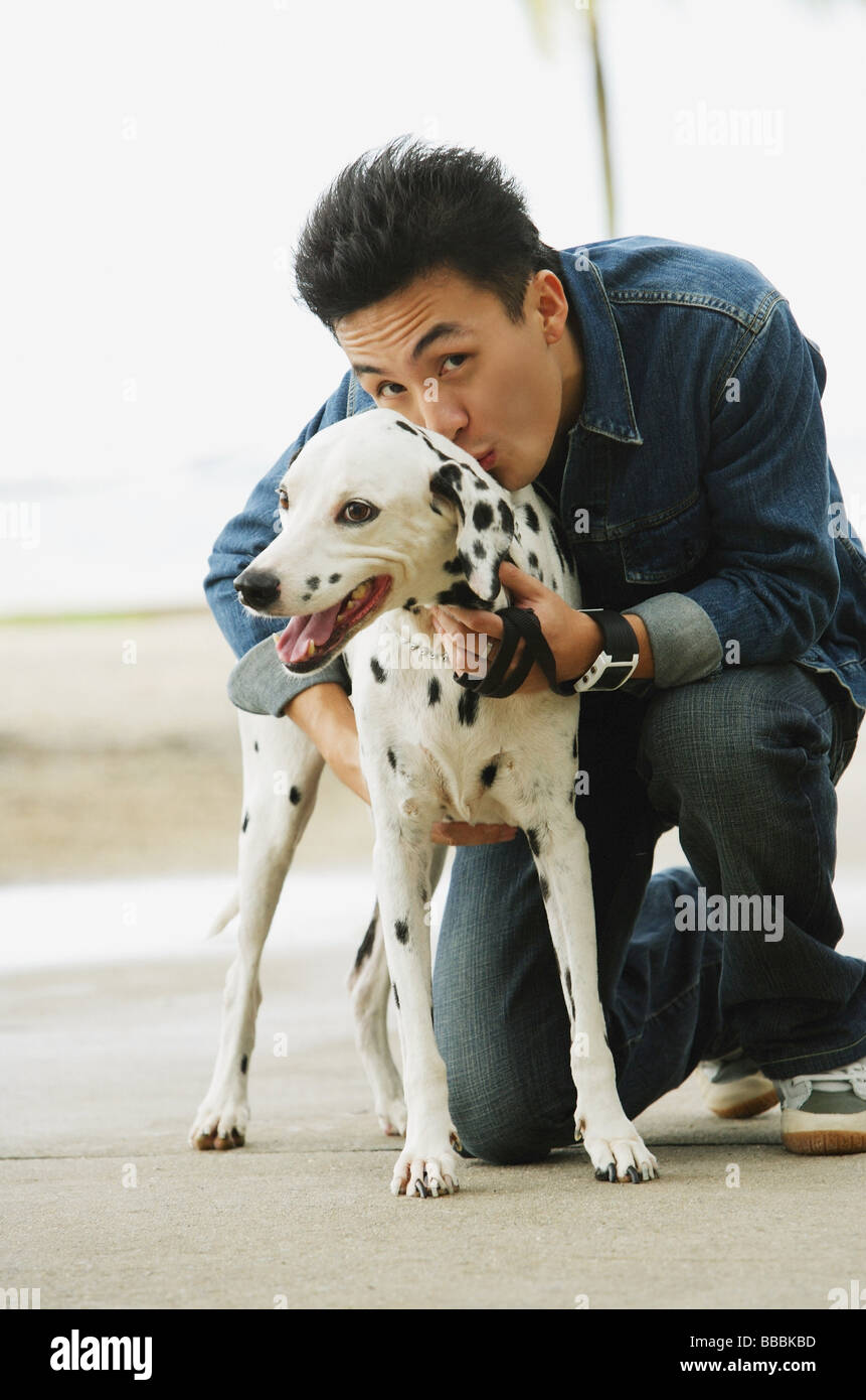 Man with Dalmatian dog, smiling at camera Stock Photo - Alamy