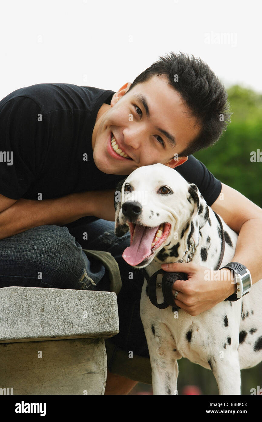 Man hugging Dalmatian Stock Photo - Alamy