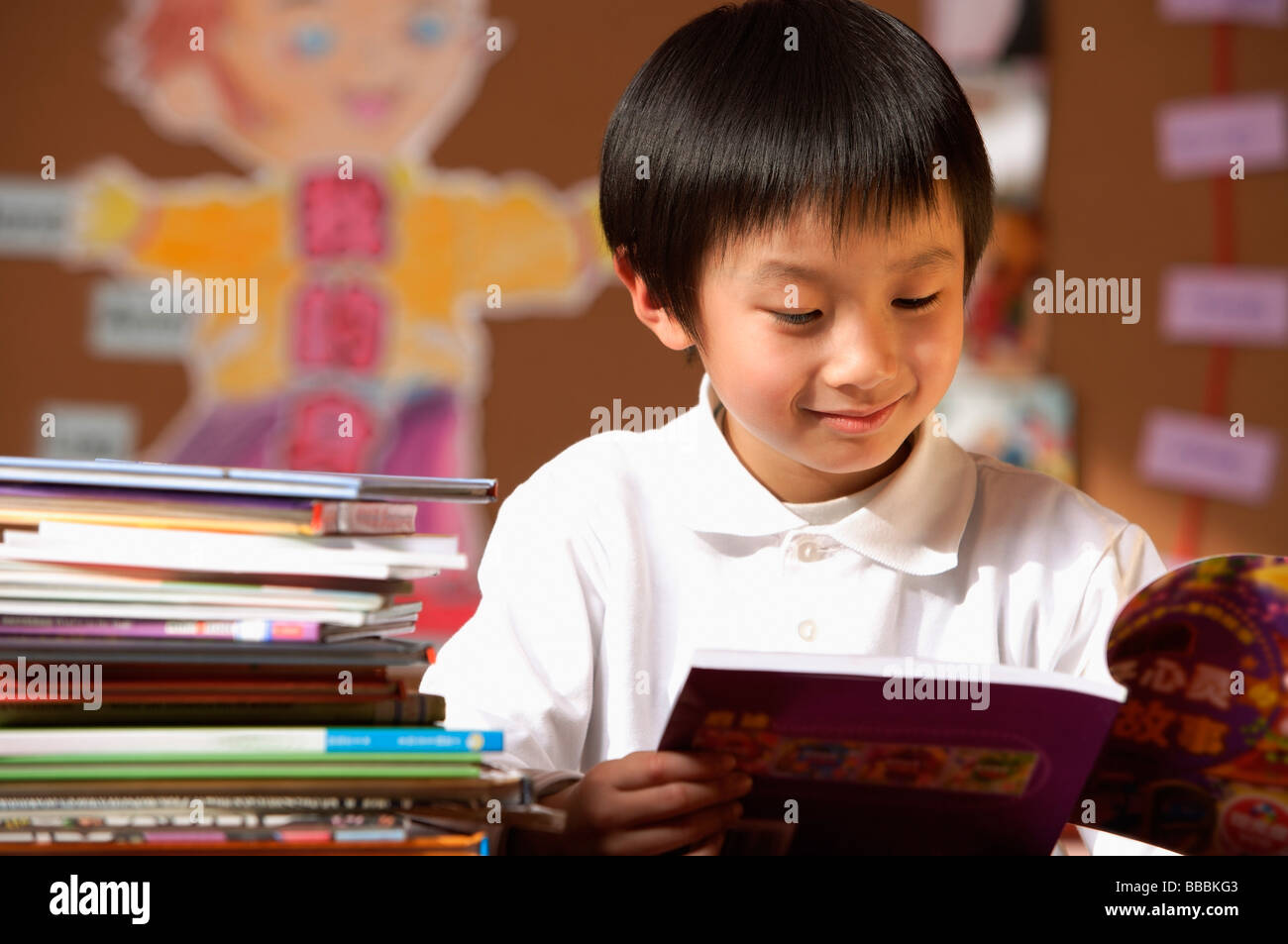 Schoolboy reading book Stock Photo - Alamy Schoolboy reading book Stock Photo - Alamy