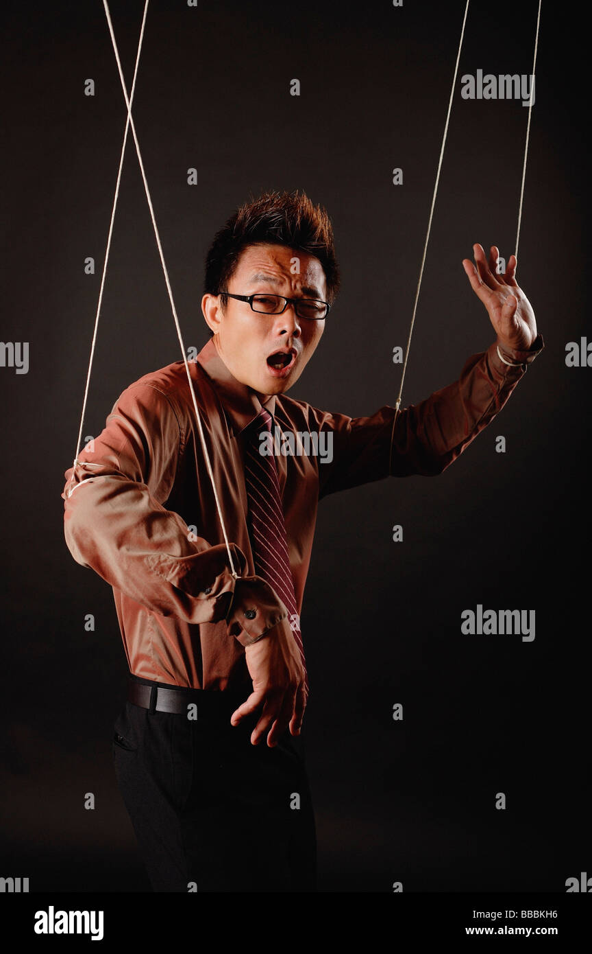 Marionette strings hi-res stock photography and images - Alamy