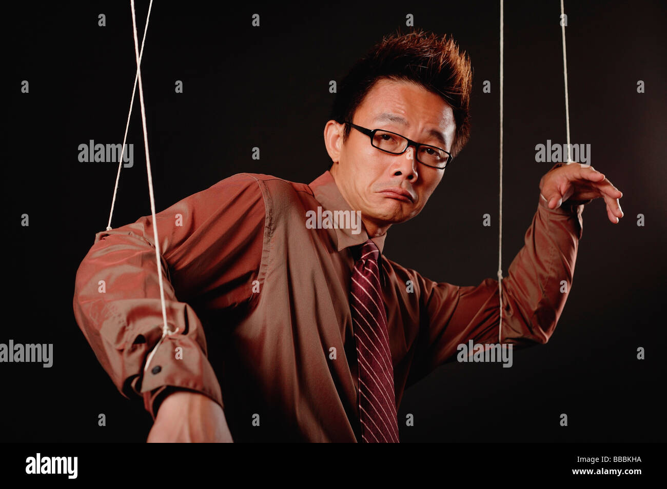 Puppet strings hands hi-res stock photography and images - Alamy