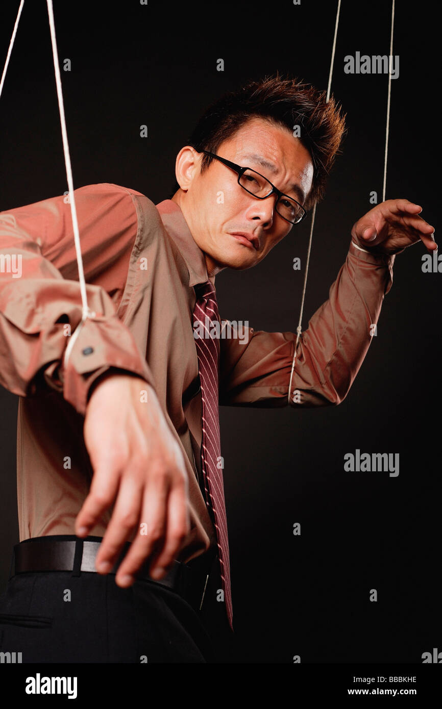 Puppet strings hands hi-res stock photography and images - Alamy