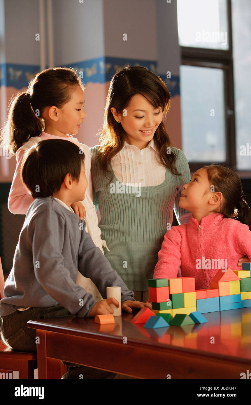 Young school children with their teacher Stock Photo - Alamy