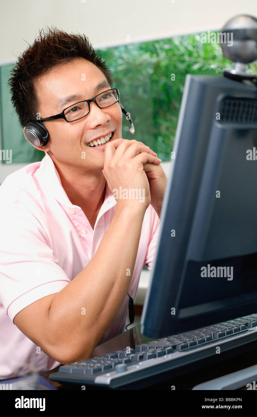 Man using computer and webcam Stock Photo - Alamy