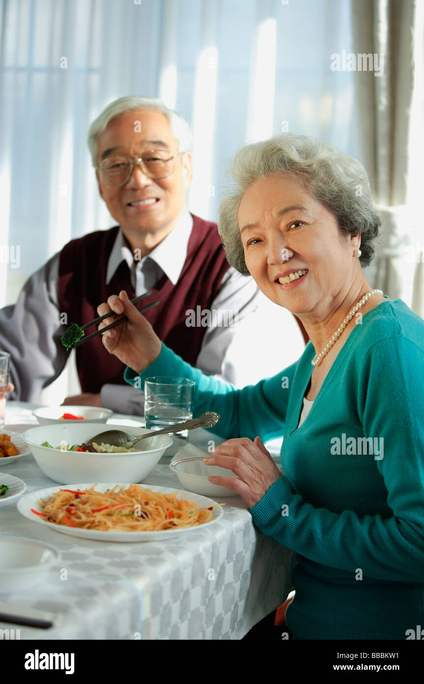 Elderly couple at dinner table Stock Photo - Alamy