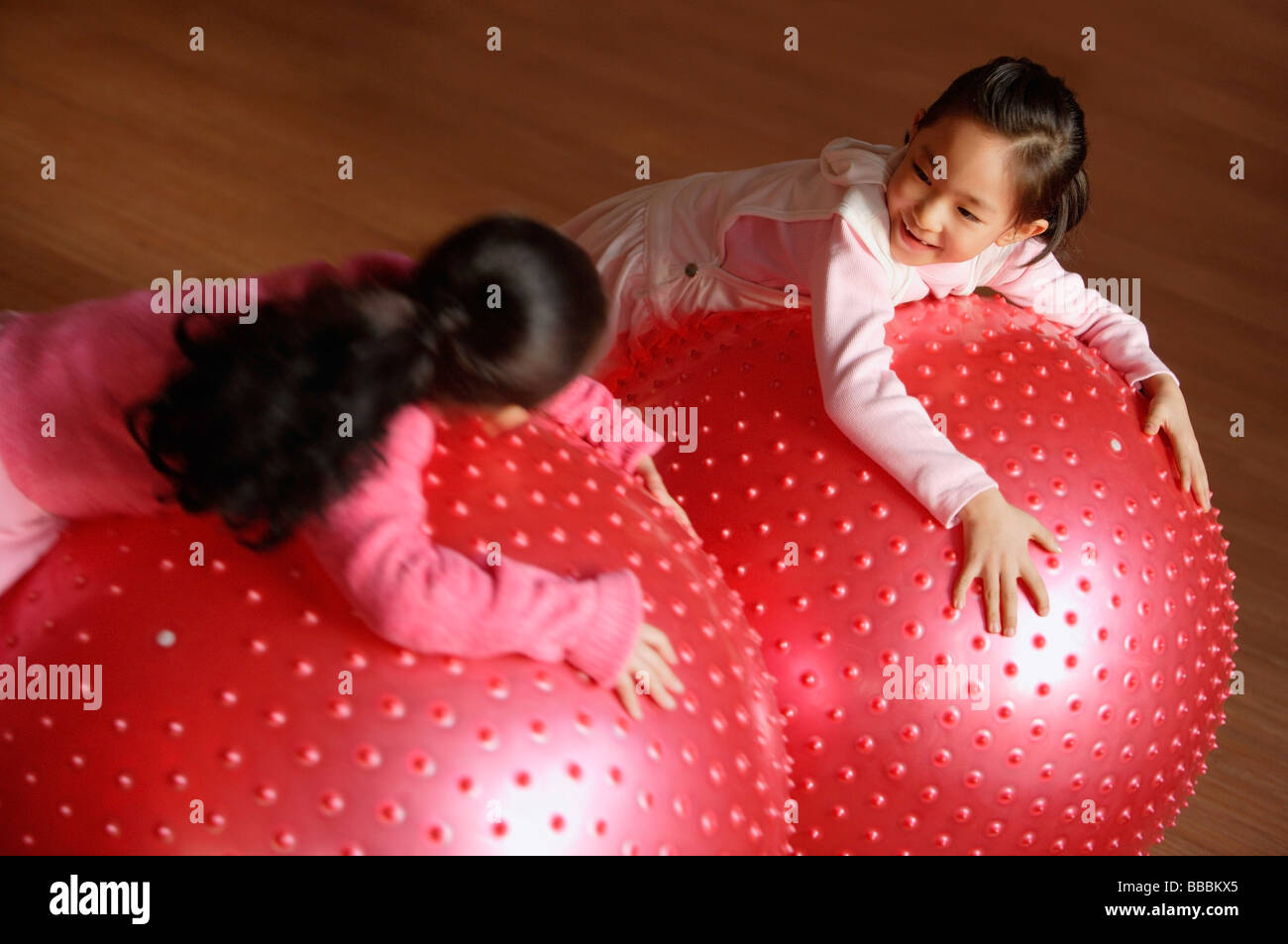 Two Girls Leaning On Balls High Resolution Stock Photography and Images ...
