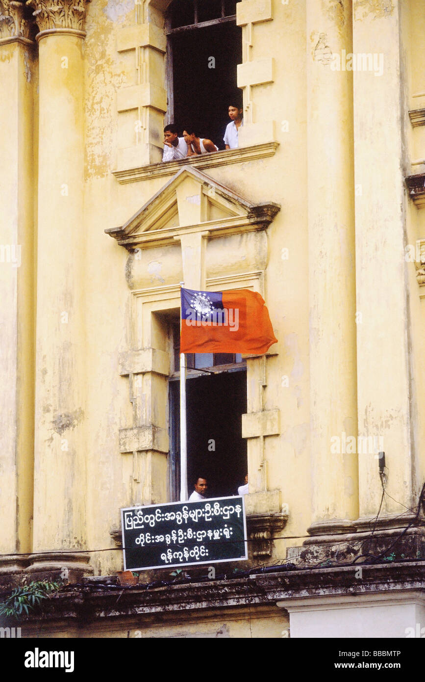 Myanmar (Burma), Yangon (Rangoon), Flag in windowsill of old colonial ...