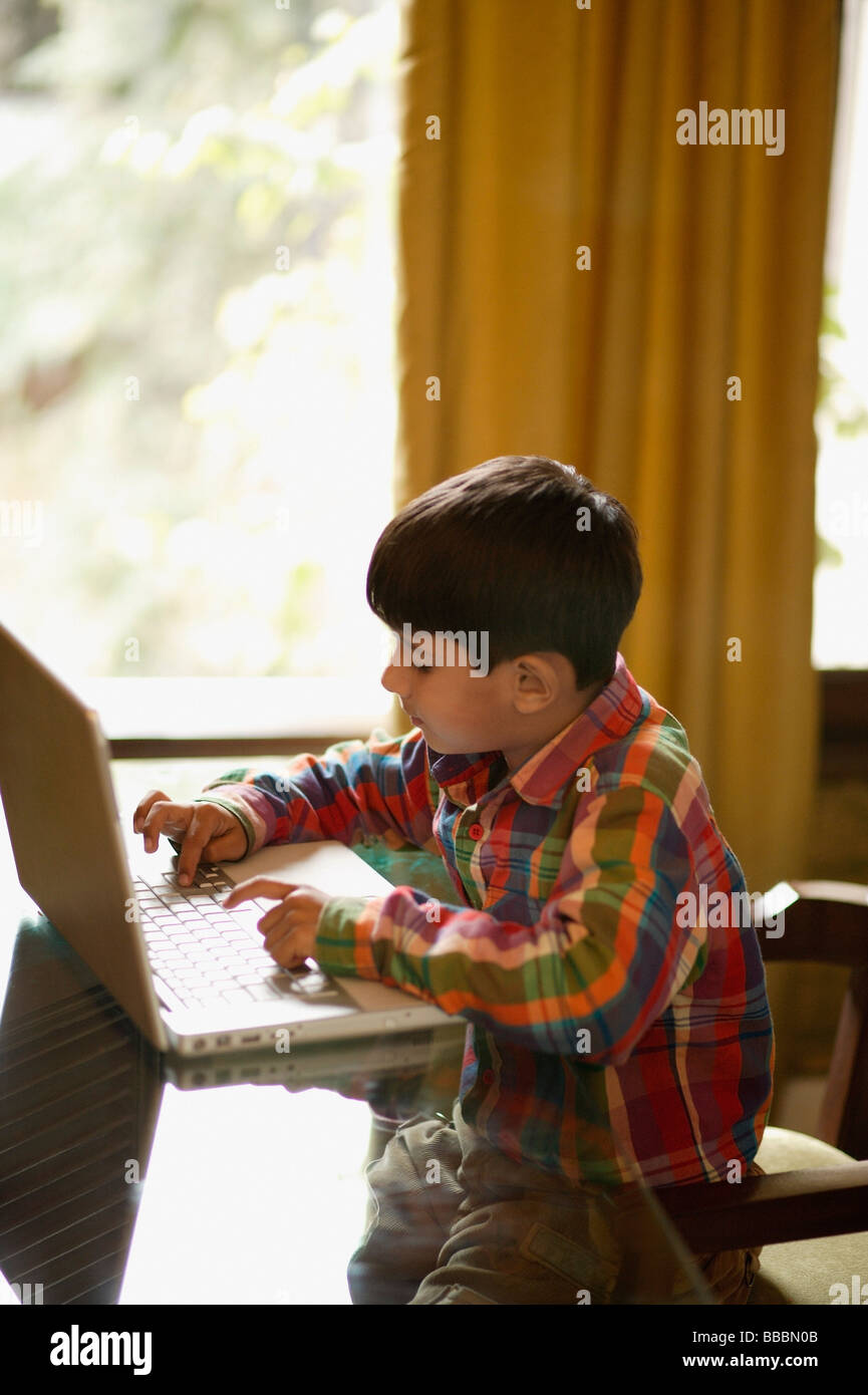 little boy working at laptop Stock Photo - Alamy