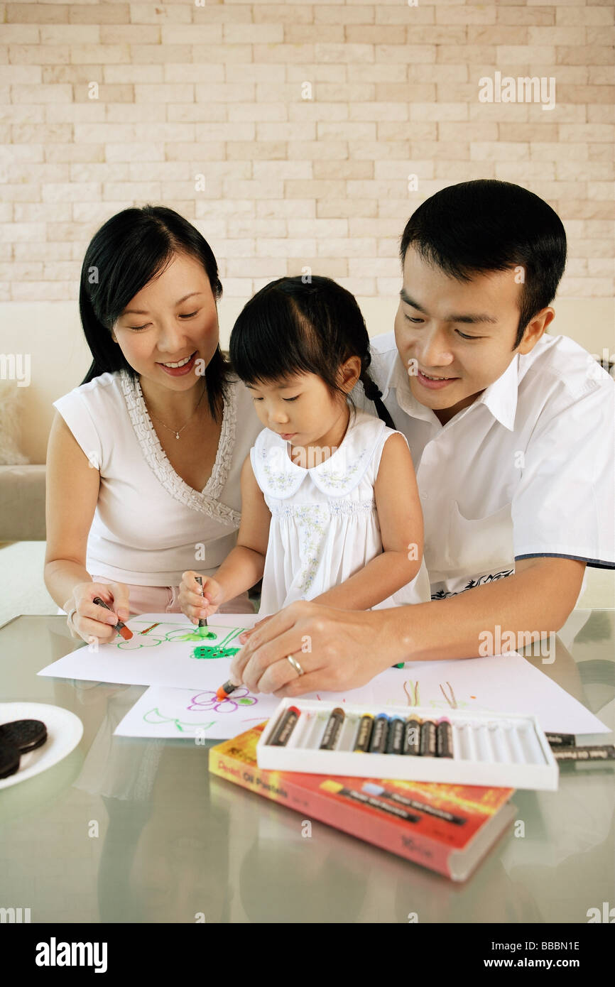 Family with one child, daughter drawing Stock Photo - Alamy