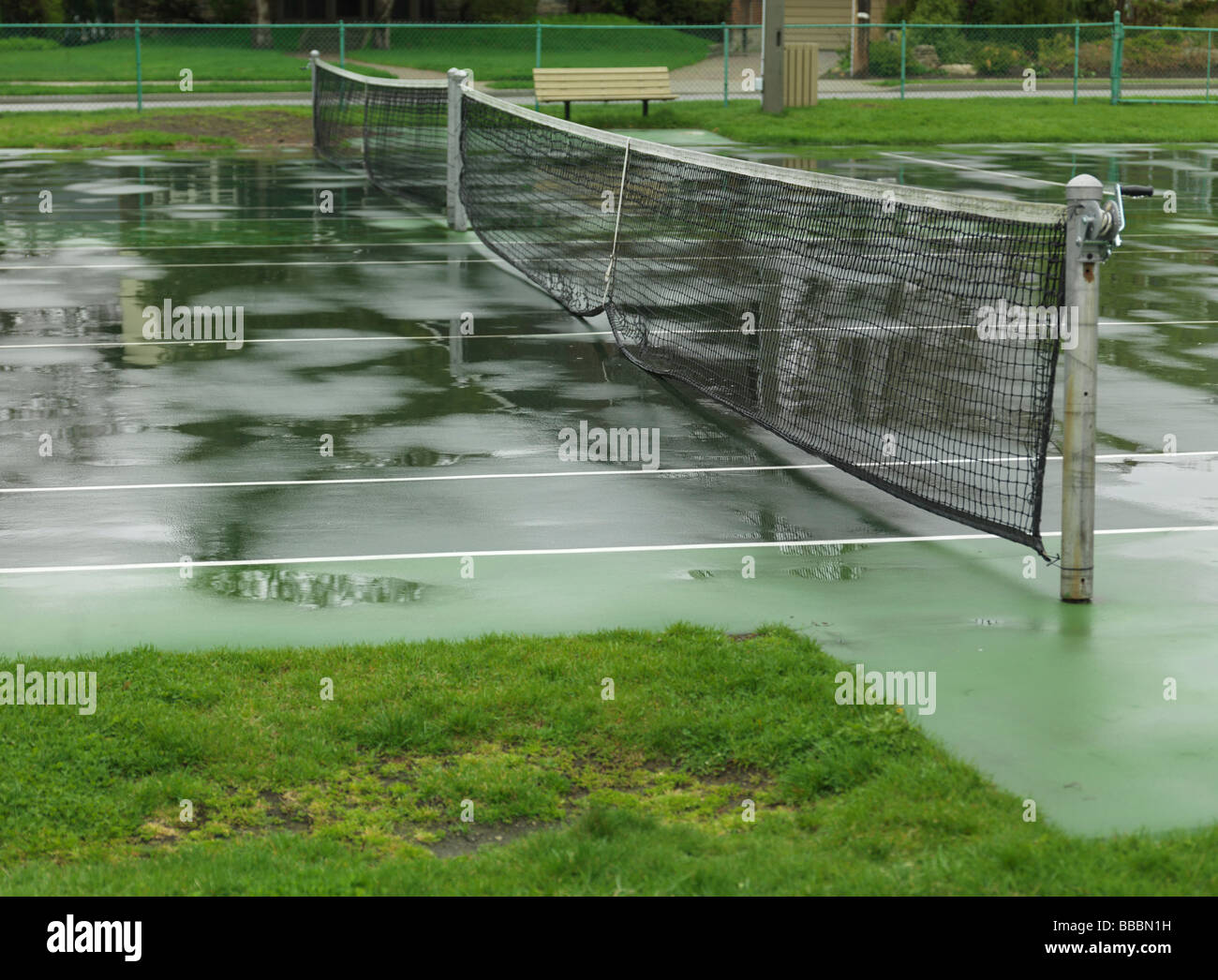 Tennis courts after rain Stock Photo - Alamy