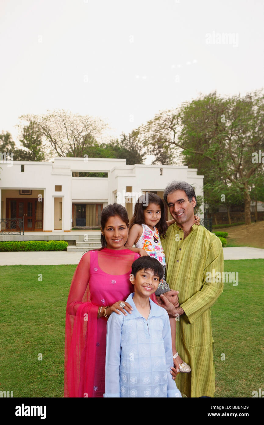 Rich Family In Front Of House