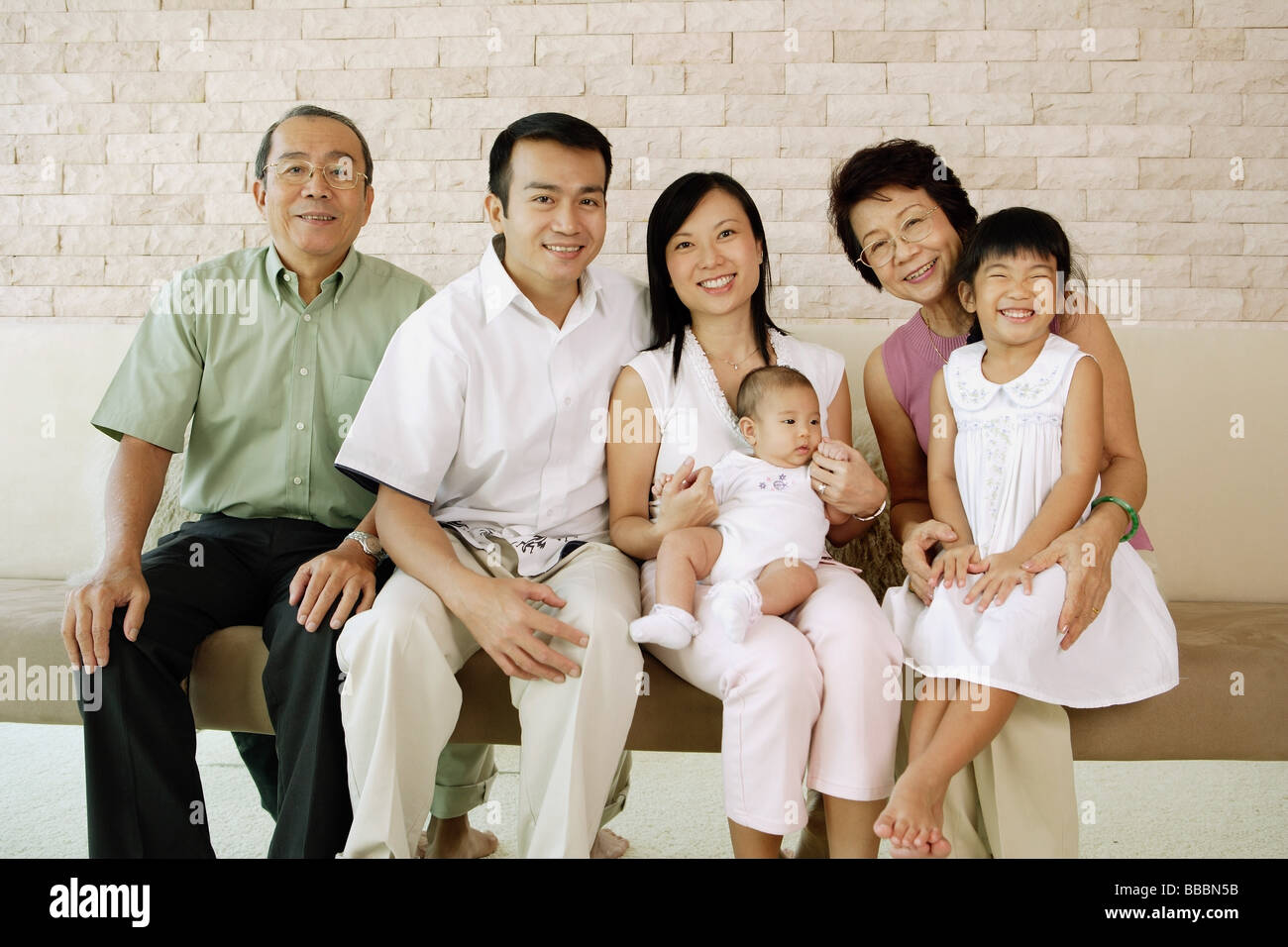 Family portrait, three generations, looking at camera Stock Photo - Alamy