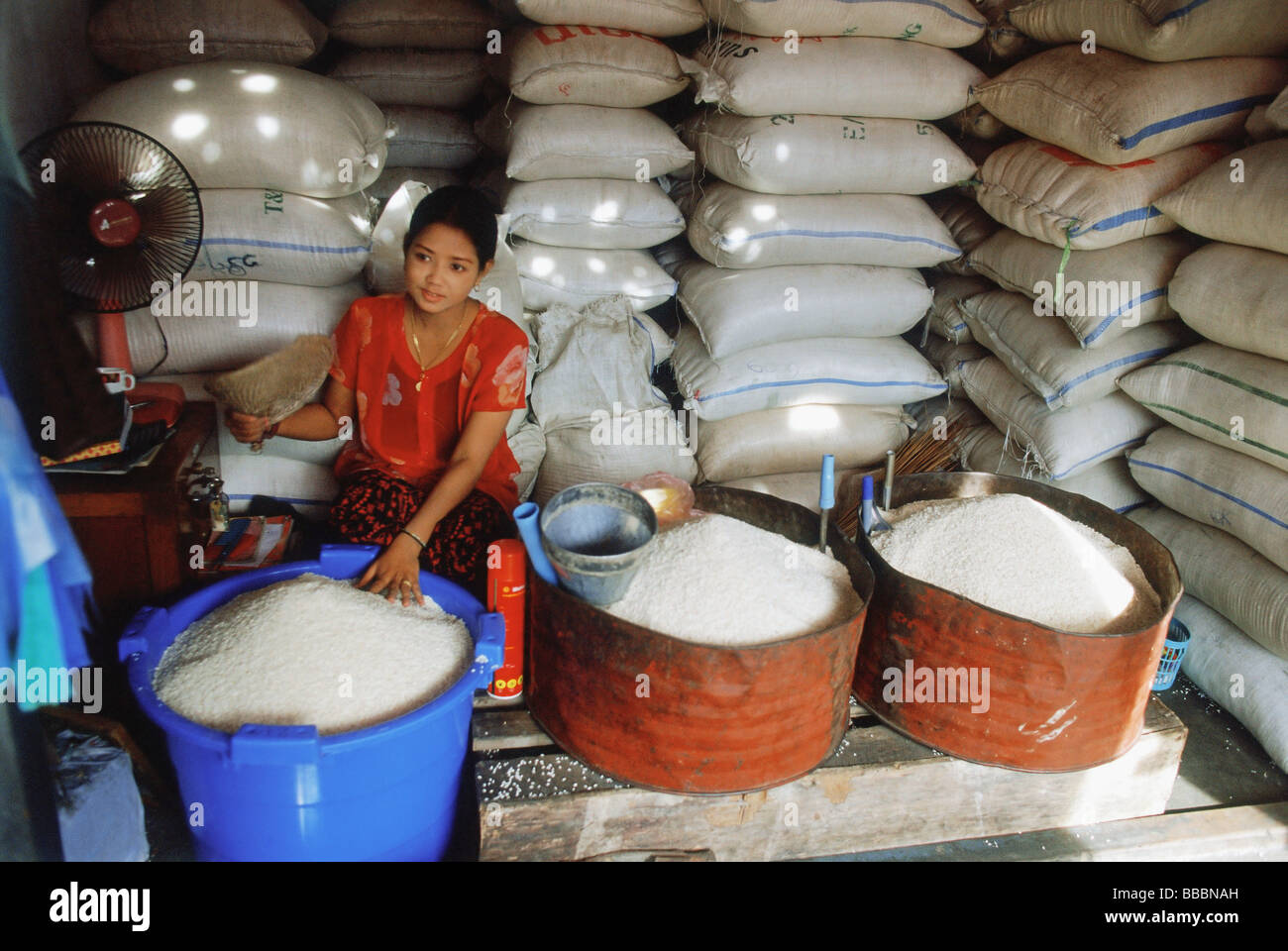 Myanmar Burma Yangon Rangoon A Burmese Woman Selling Rice Of myanmar-burma-yangon-rangoon-a-burmese-woman-selling-rice-of