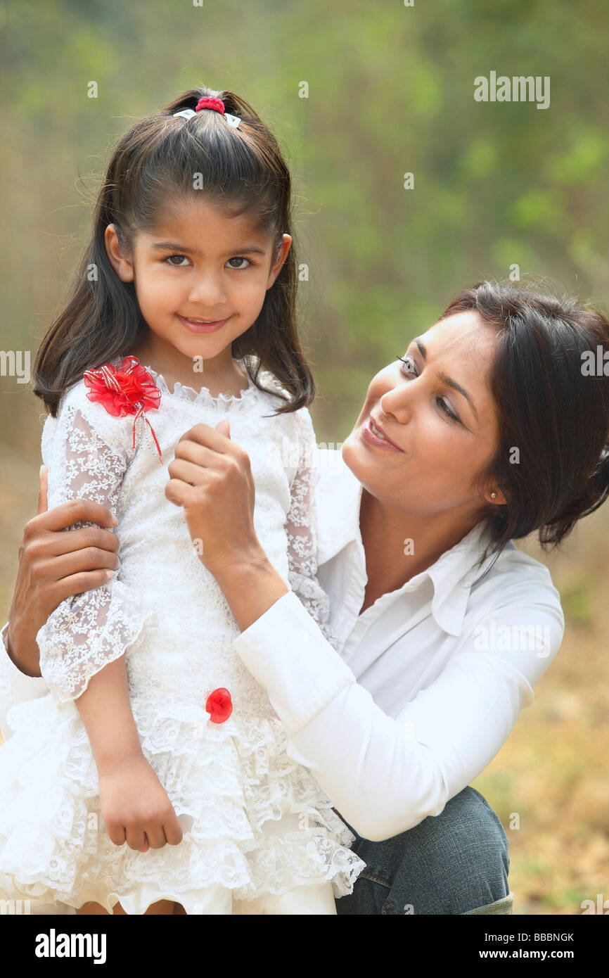 Mother hugging daughter, outside Stock Photo - Alamy