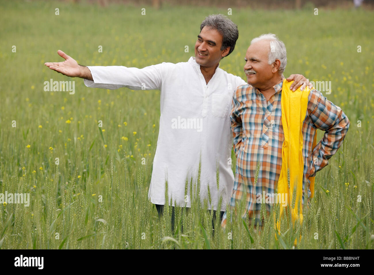 father and son farmers in field Stock Photo - Alamy
