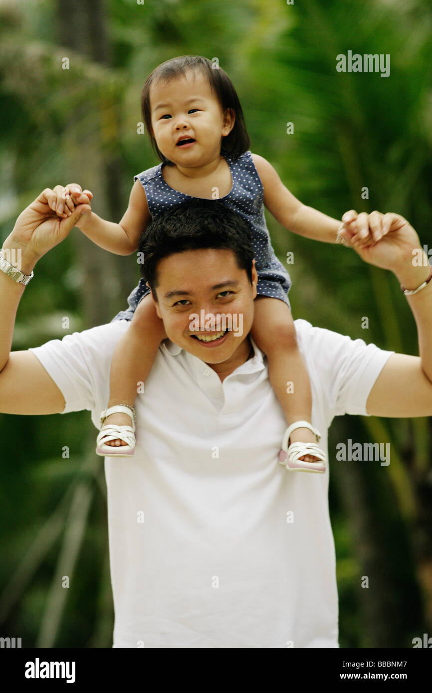 Father carrying daughter Stock Photo - Alamy